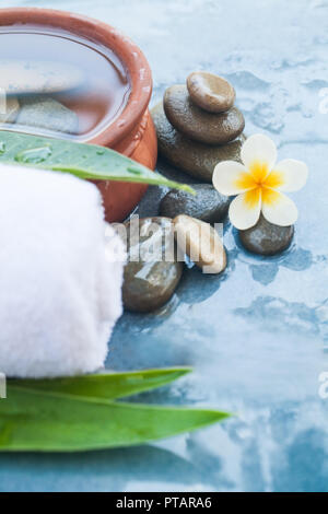 Objects and stones for relax and spa massage treatment on blue ...