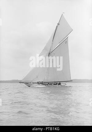 The 40-rater cutter 'Carina' sailing close-hauled, 1911. Creator: Kirk ...
