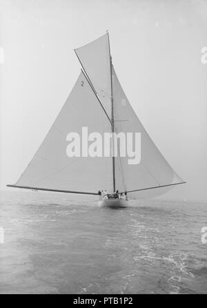 The 40-rater cutter 'Carina' sailing with spinnaker, 1913. Creator ...