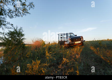 DNIPROPETROVSK REGION, UKRAINE - JUNE 19, 2017: Vaz Niva blue-green ...
