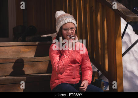 Girl using mobile phone during winter Stock Photo - Alamy