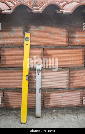 Construction level used vertically to measure the galvanized steel ...