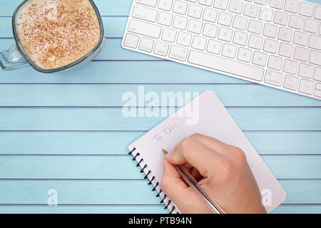 Someone Writing a To Do List in a Spiral Notebook Stock Photo - Alamy