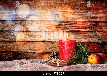 Red candle with christmas decoration, snow and copy space Stock Photo ...