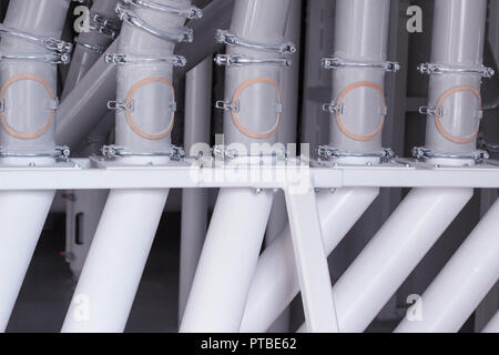 Plant for the production of food flour, a lot of metal pipes through ...