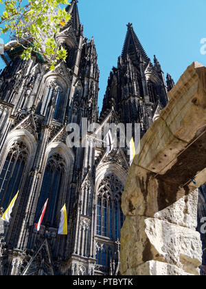 Koln Cologne Cathedral twin spires silhouetted floodlit against evening ...