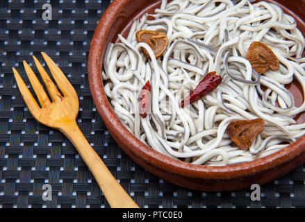 mud casserole with elvers cooked with garlics and bobbies Stock Photo ...