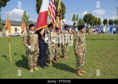 U.S. Soldiers assigned to the 414th Contracting Support Brigade salute ...