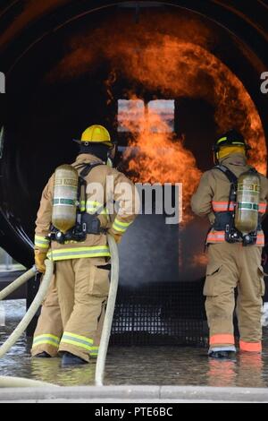 US Navy Firefighters conduct annual rope rescue training from a water ...