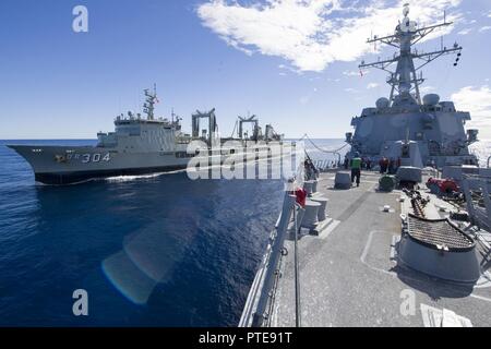 USS Sterett conducts a force replenishment-at-sea with the Royal ...