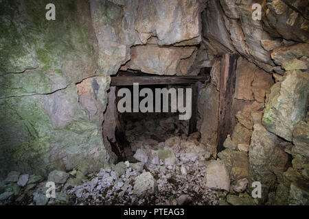 entrance into bunker carved into rock Stock Photo - Alamy