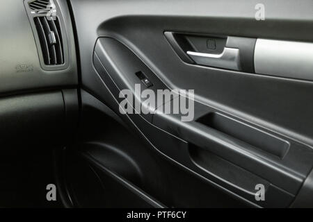 Modern car interior door handle close up. Metallic Car door opener ...