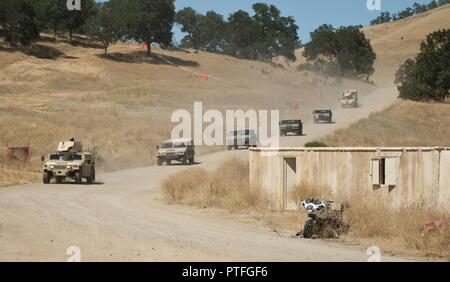A column of vehicles from the 344th Military Police Company, 485th ...