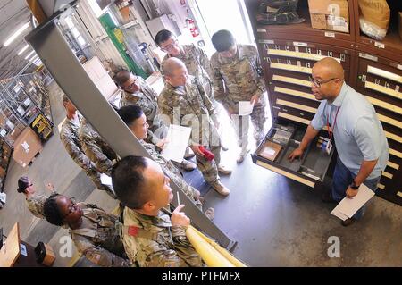 Soldiers at the supply support activity warehouse inventory equipment ...