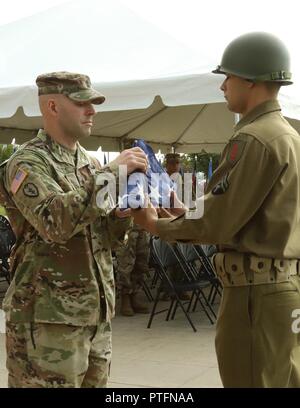 The 1st Armored Division Color Guard march with the colors during the ...