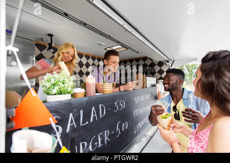 happy customers buying burger at food truck Stock Photo - Alamy