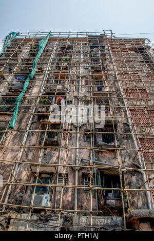Building construction in India. A bamboo scaffold being used to support ...