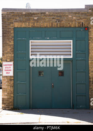 Vintage green double doors with white decorative molding and transom ...