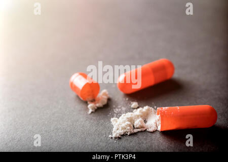 Open capsule powder medication, conceptual image Stock Photo - Alamy