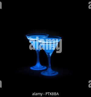 Glowing blue tonic water, quinine, as used in gin and tonic emmits ...