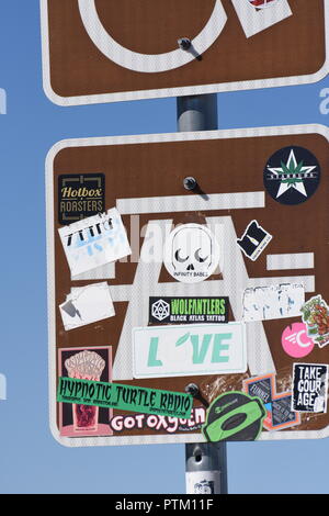 Defaced Street signs for handicapped and informational concepts with ...