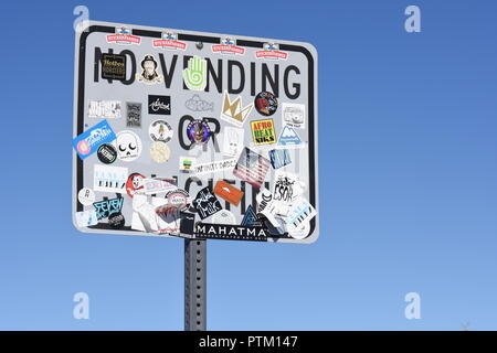 Defaced Street signs for handicapped and informational concepts with ...