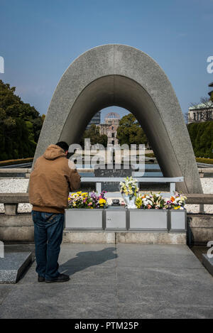 Cenotaph for the Atomic bomb victims, in background Atomic Bomb Dome, Peace Park, Hiroshima ...
