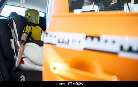 Small crash test dummy in car symbol for safe driving Stock Photo - Alamy