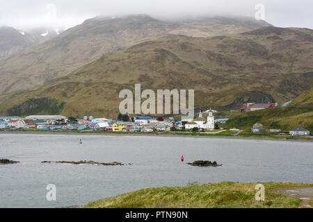 The city of Unalaska, also known as Dutch Harbor, surrounded by ...