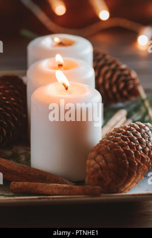 Cozy evening scene with candles, white wine glasses and warm candle ...
