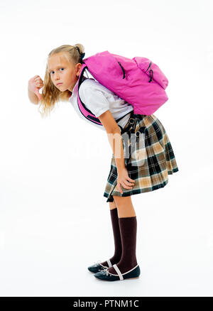 Little and sad girl with backpack on her back with school supplies with ...