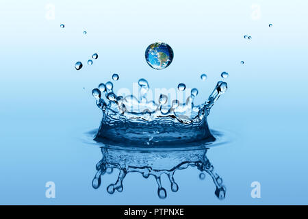 Earth in water drop reflection under green leaf, Elements of this image ...