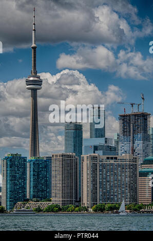 Toronto, Canada iconic skyline and towers at twilight on Lake Ontario ...