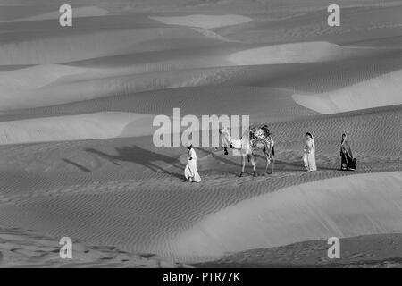 The image of Rajasthani trditional people in sand dunes of Jaisalmer ...