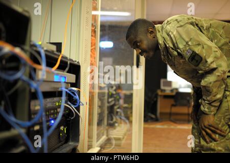 British Army soldier checks computer server equipment Stock Photo - Alamy