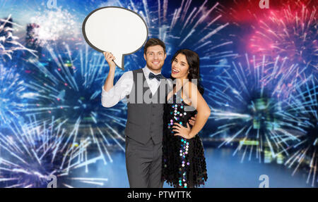 happy couple at party holding text bubble banner Stock Photo - Alamy