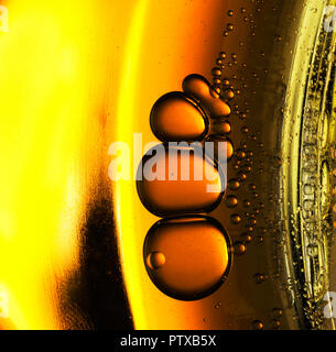 close up of a drop oil on a yellow background Stock Photo - Alamy