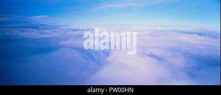 Sky with cirrus, stratus clouds, airplane trail and halo from the sun ...