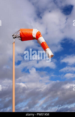 Runway with windsock on windy day at Seymour airport on Baltra Island ...