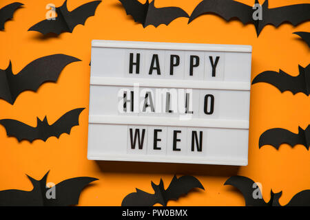 Happy halloween lightbox message with black scary bats Stock Photo - Alamy