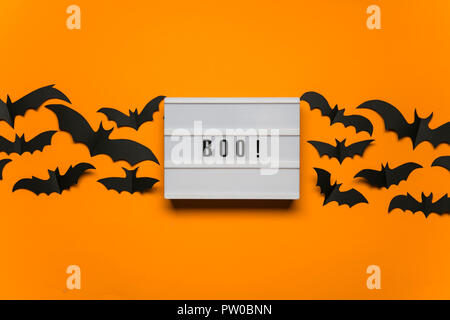 Boo! halloween lightbox message with black scary bats Stock Photo - Alamy