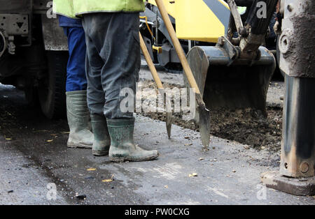 Tractor strong outrigger stabilizing legs extended to stabilize and ...