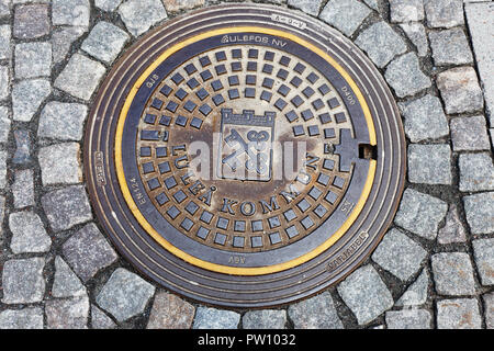 iron manhole covering with coat of arms of the town Saint Malo in ...