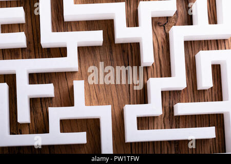Overhead View Of Abstract White Maze On Wooden Background Stock Photo ...