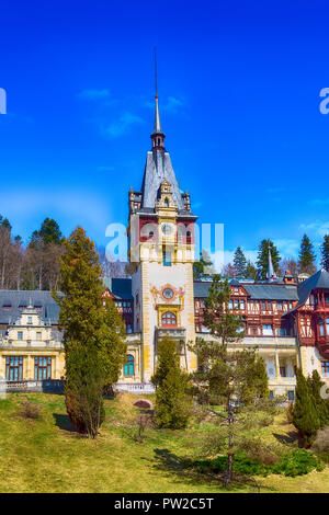 A vertical of the Peles castle in the snow-covered Carpathian Mountains ...