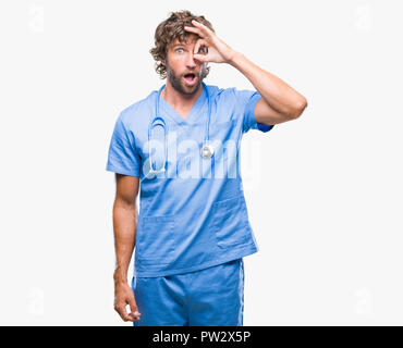 Hispanic man at the doctor doing ok sign with fingers, smiling friendly ...