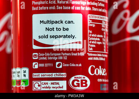 Close-up of a label on a Coca-Cola bottle reading "Contains ingredients ...