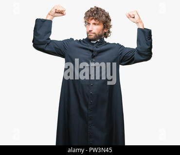 Religion concept. Handsome hispanic catholic priest man over black ...