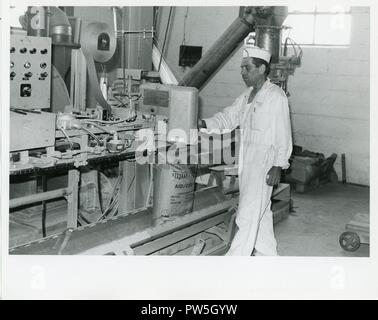 Snapshot of a man working in a factory Stock Photo - Alamy