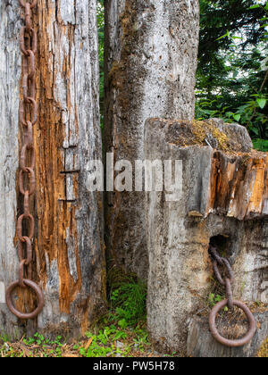 Rusty Chain on Wooden Posts by Rural Roadside Stock Photo - Alamy